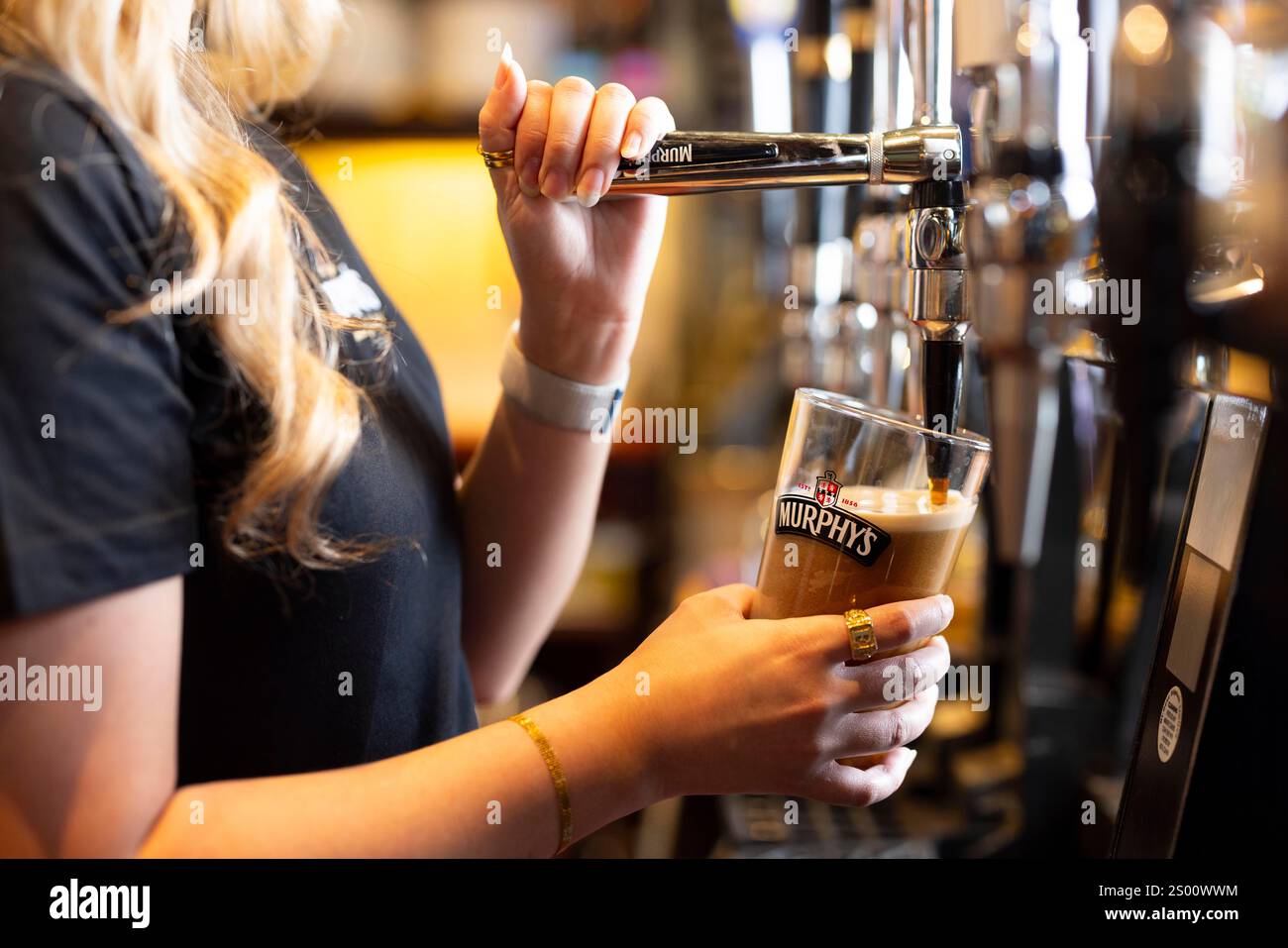 EDITORIAL USE ONLY A pint of Murphy's Irish Stout is poured after being ...