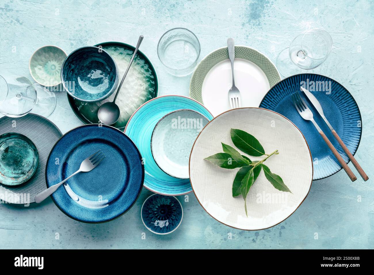 Modern tableware, overhead flat lay shot. A table setting with plates ...