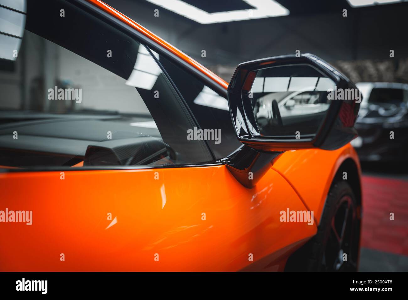 A close up view of a Lamborghini Revuelto's angular side mirror and ...