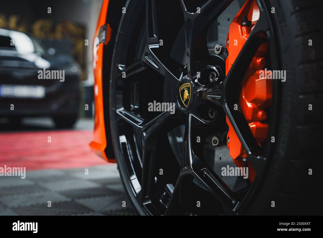 The image captures a detailed view of a Lamborghini Revuelto's wheel ...
