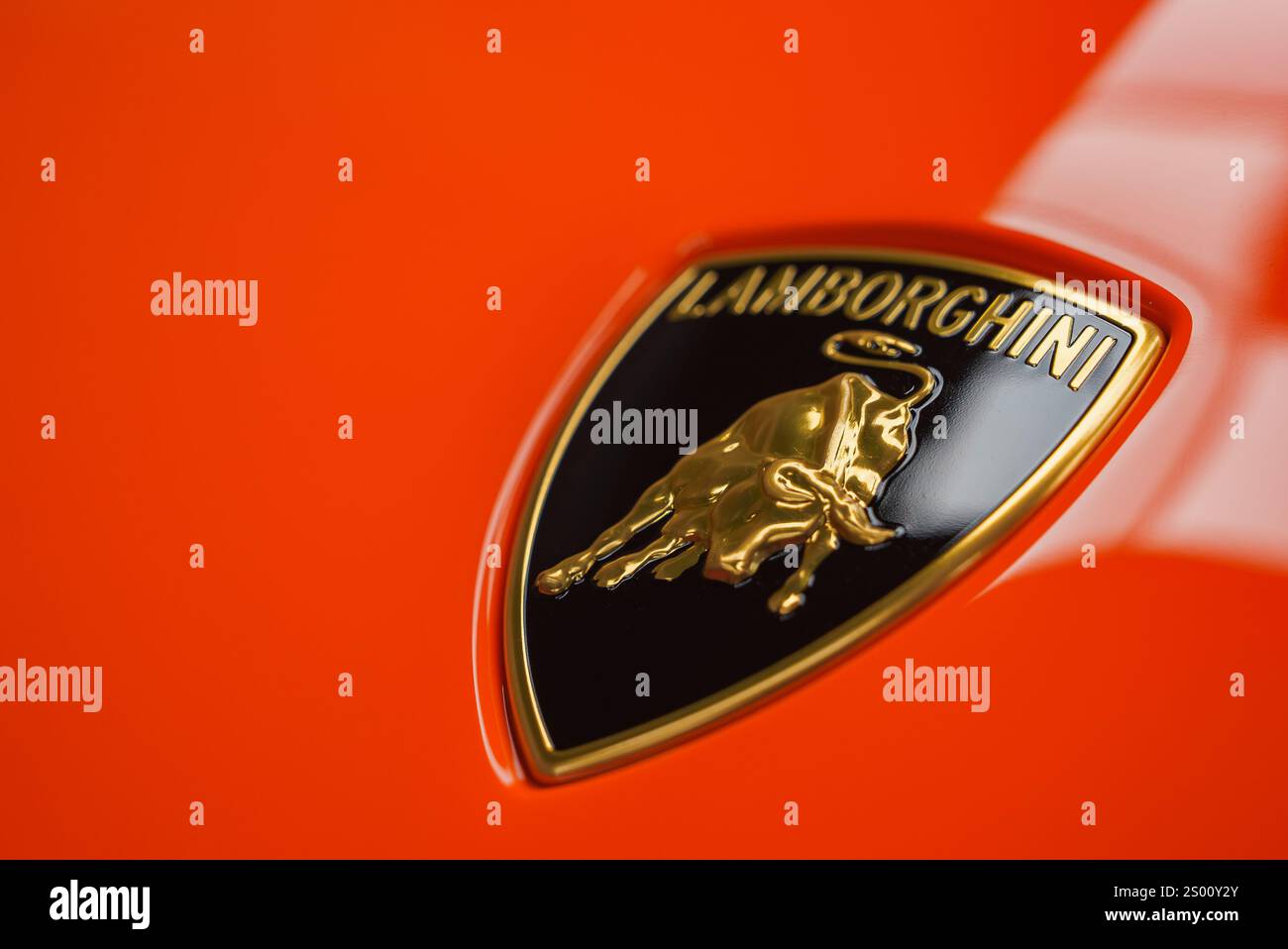 Close Up of Lamborghini Emblem on Orange Lamborghini Revuelto Hood ...