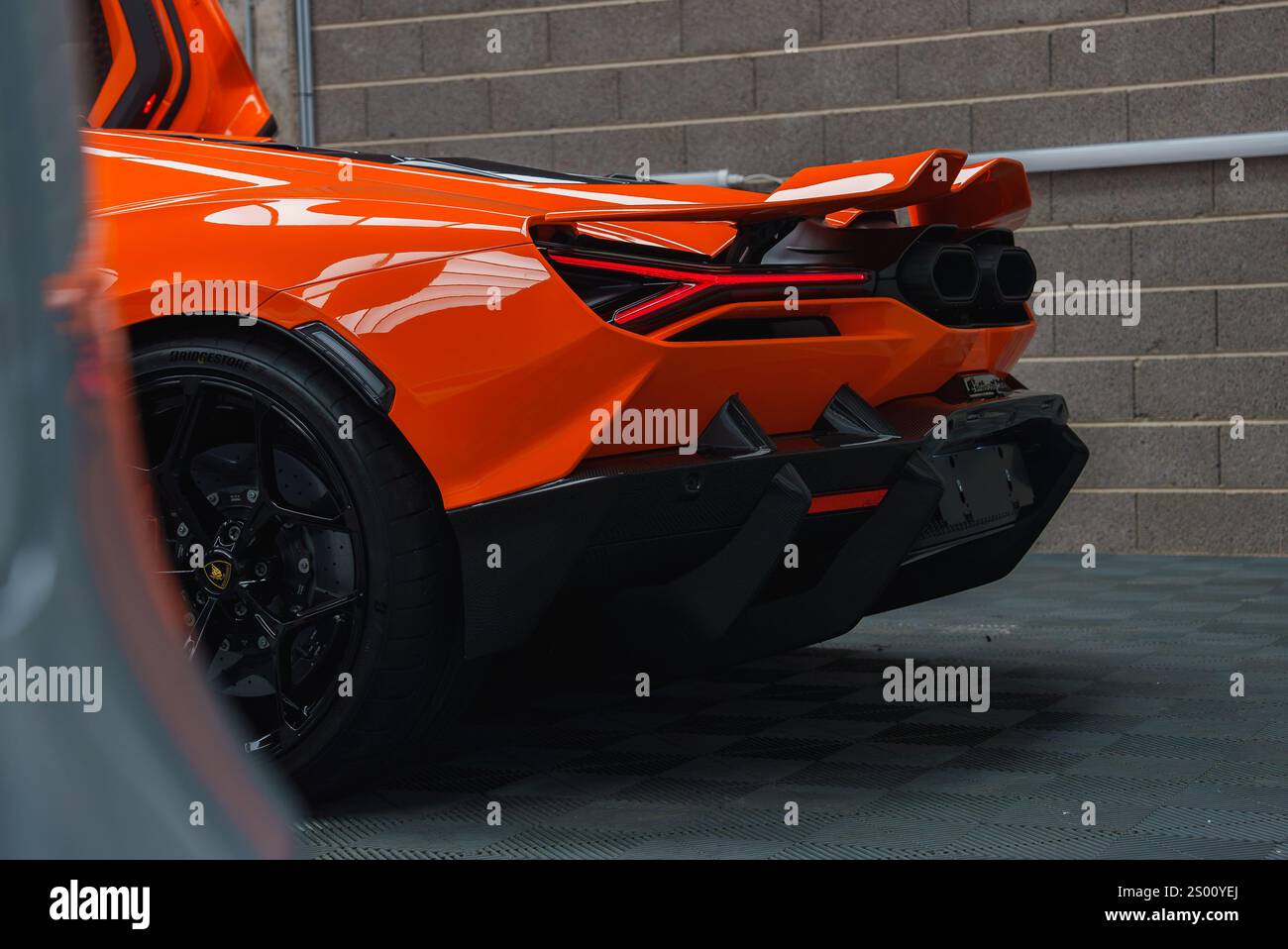 Rear View of Orange Lamborghini Revuelto in Indoor Setting Stock Photo ...