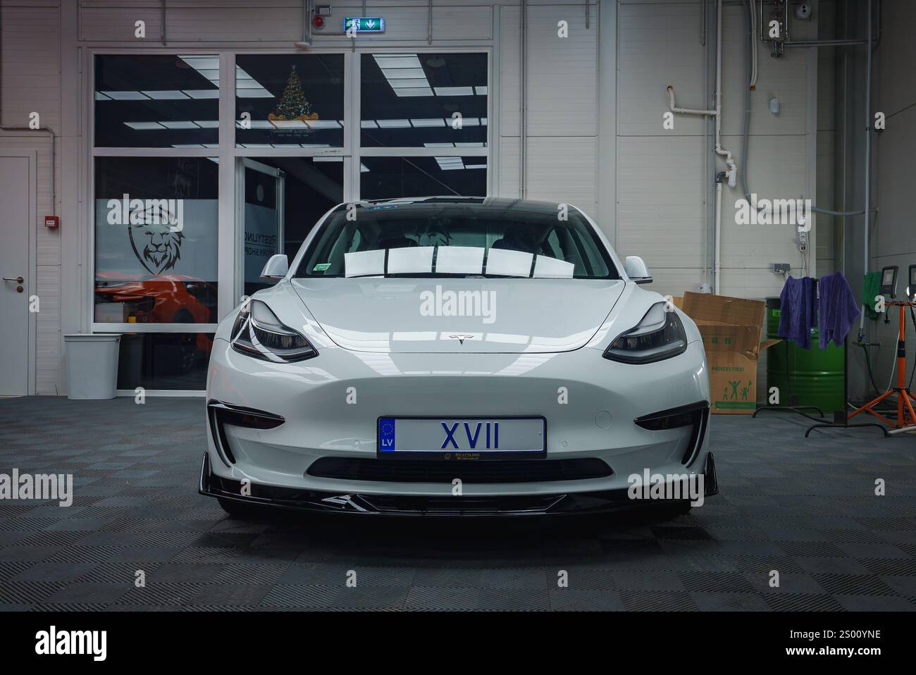 White Tesla Model 3 with Unique License Plate in Latvian Showroom Stock ...
