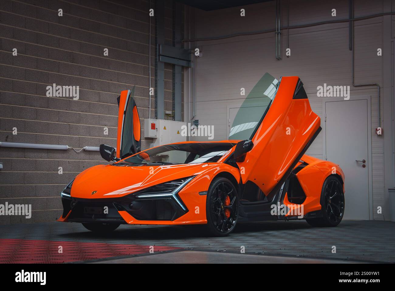 Orange Lamborghini Revuelto with Scissor Doors Open Indoors Stock Photo ...