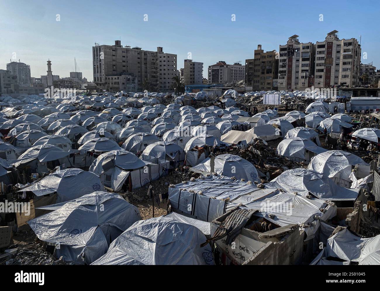 Palestinians continue to live with limited resources in the makeshift ...