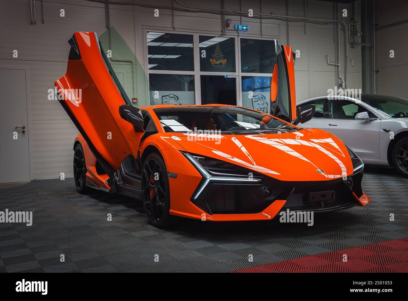 Orange Lamborghini Revuelto with Scissor Doors Open Indoors Stock Photo ...