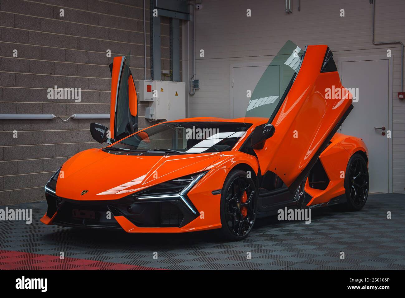 Orange Lamborghini Revuelto with Scissor Doors Open Indoors Stock Photo ...