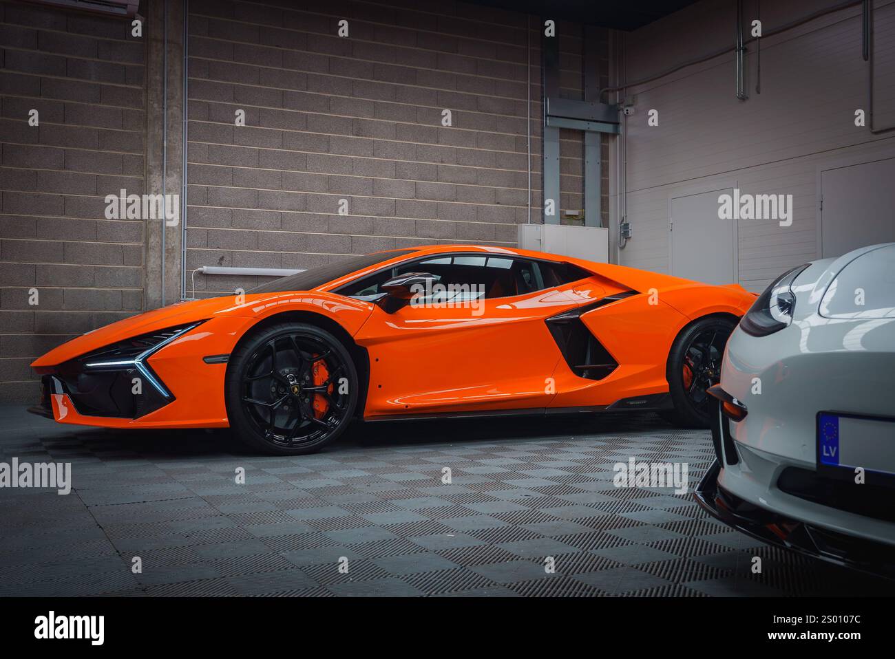 Vibrant Orange Lamborghini Revuelto in Indoor Showroom Setting Stock ...
