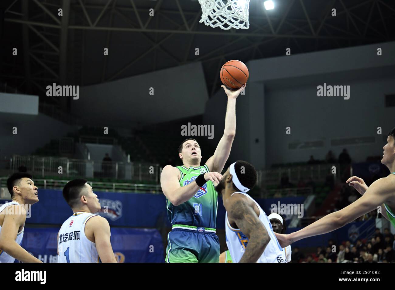 Tianjin, China. 23rd Dec, 2024. David Scott James (C) of Tianjin ...