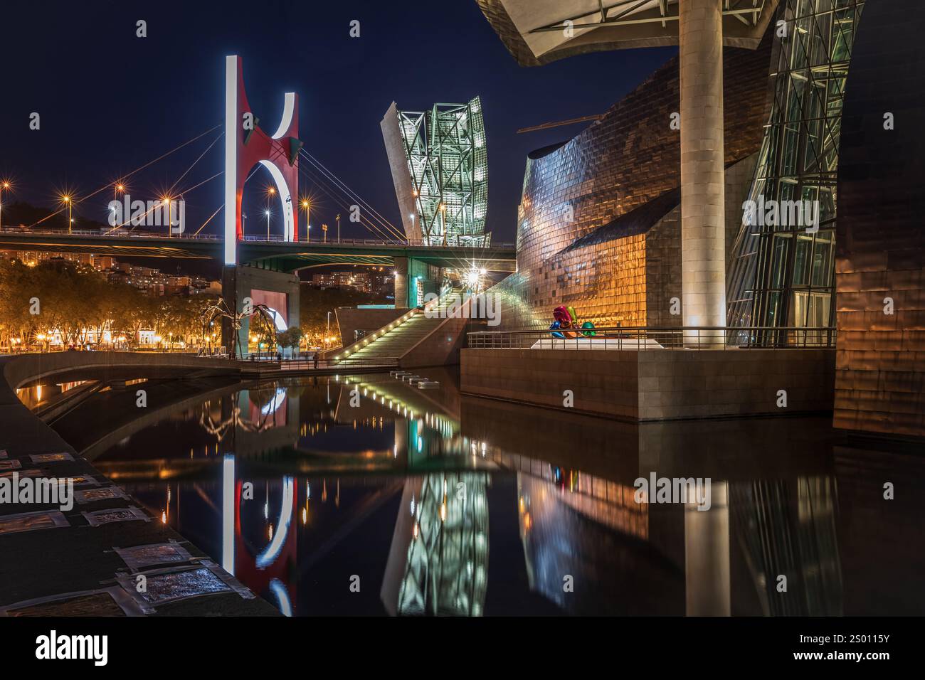 Night view of Bilbao featuring the illuminated La Salve Bridge ...