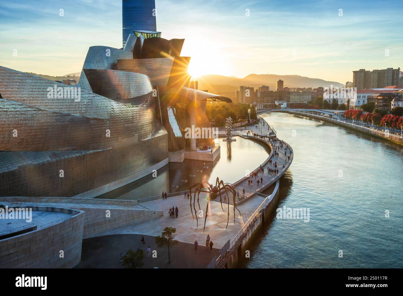 Sunset view of the Guggenheim Museum in Bilbao, featuring a modern ...