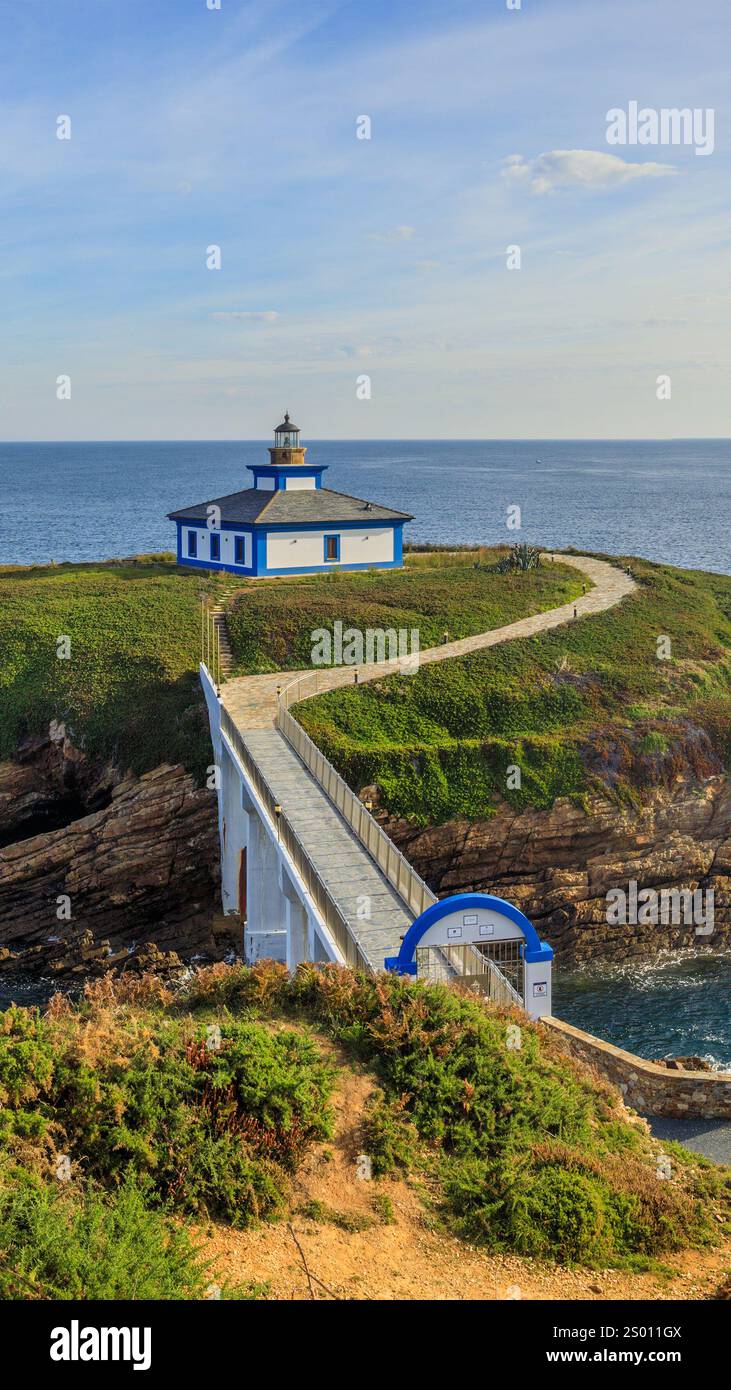 The Ribadero Lighthouse in northern Spain stands on a rocky promontory ...
