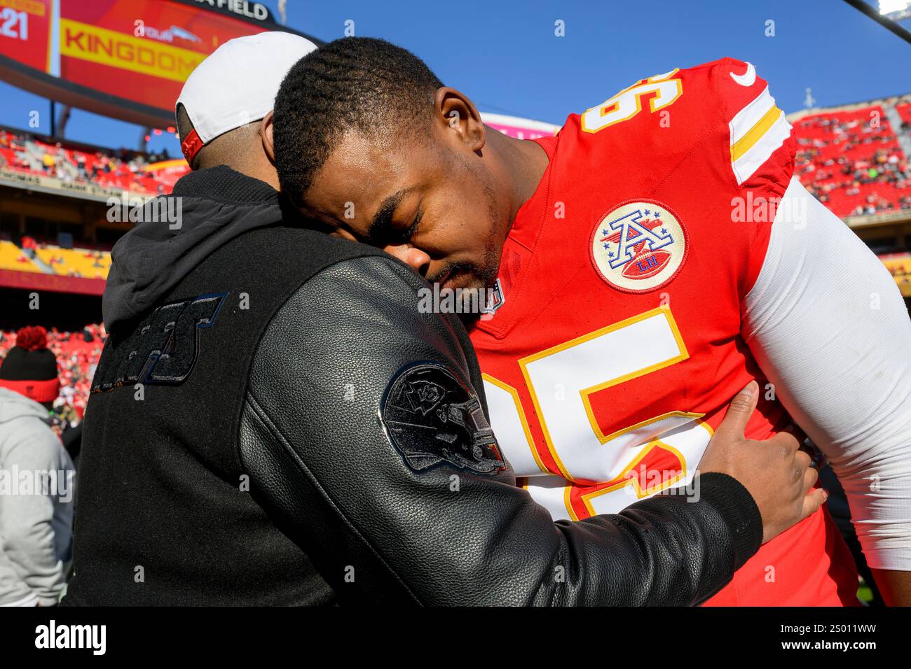 Kansas City Chiefs defensive tackle Chris Jones, right, receives some ...
