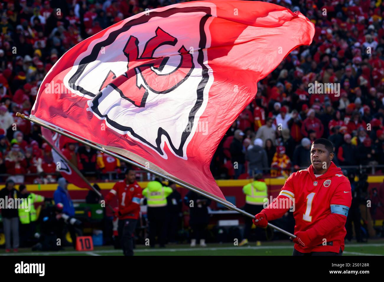 A Kansas City Chiefs flag runner waves the team flag after a touchdown ...