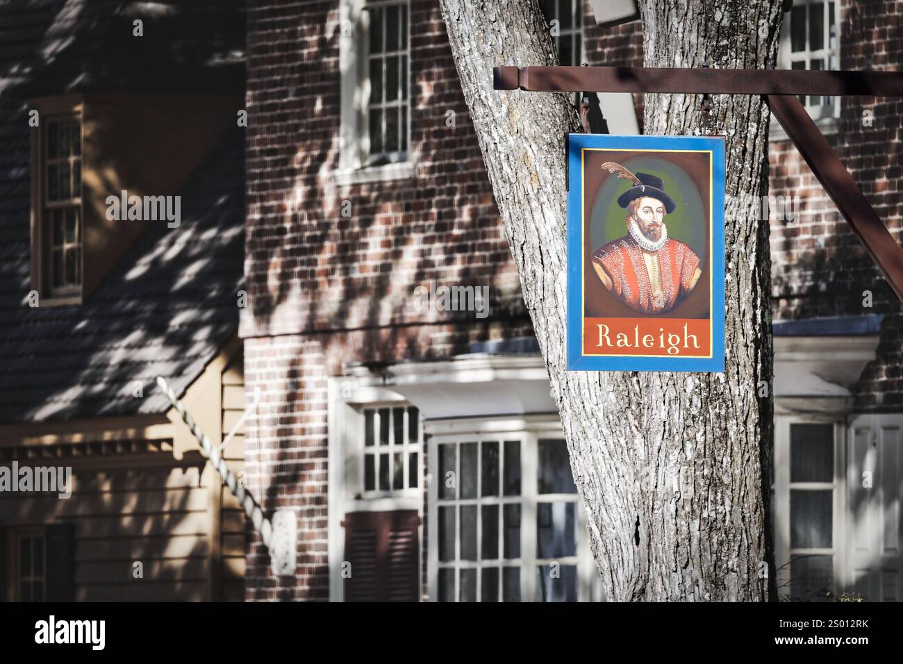 The sign for the Raleigh Tavern in the historic colonial district at ...