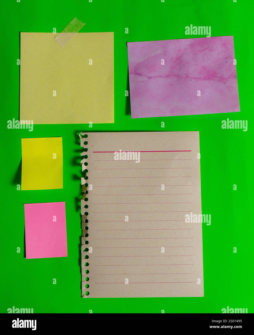 Different blank note papers of different sizes, colors and shapes on a ...