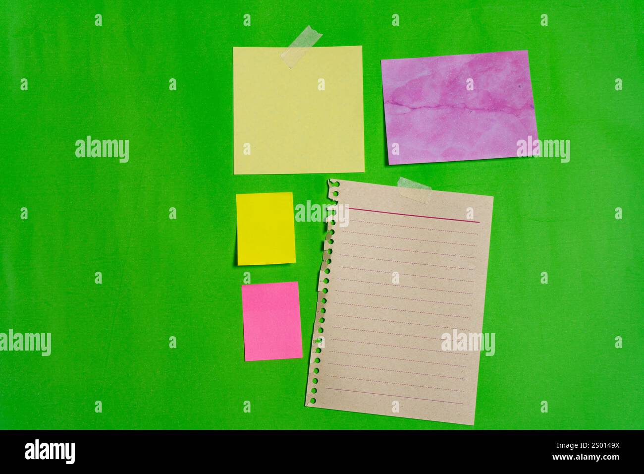 Different blank note papers of different sizes, colors and shapes on a ...