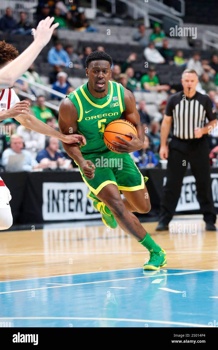 SAN JOSE, CA - DECEMBER 21: Oregon Ducks guard TJ Bamba (5) drives the ...
