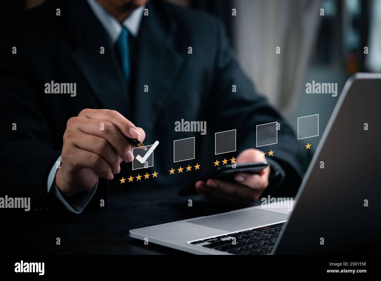 Person selecting a rating star on a laptop, symbolizing customer ...