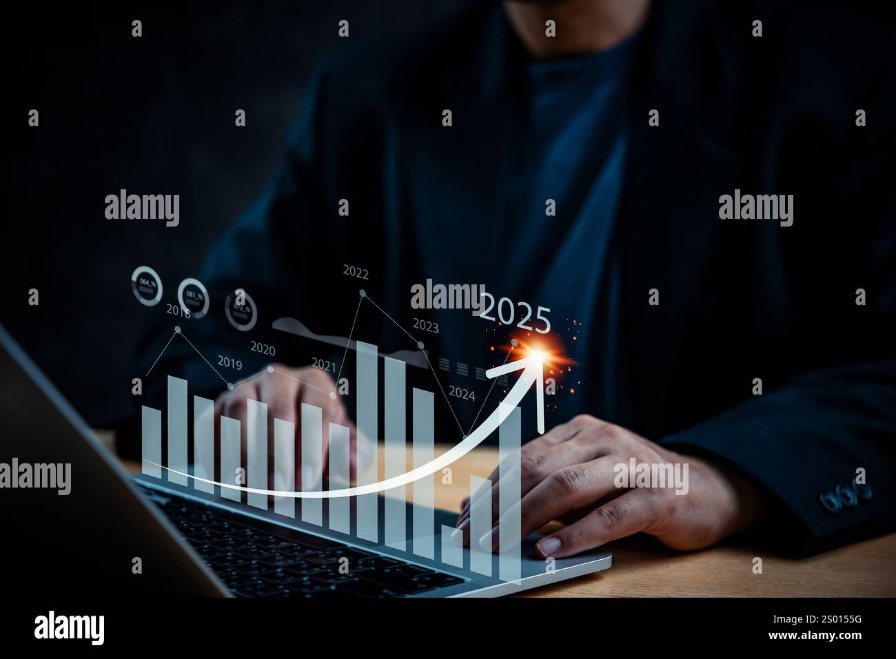 Business professional using laptop with a growth chart showing upward ...
