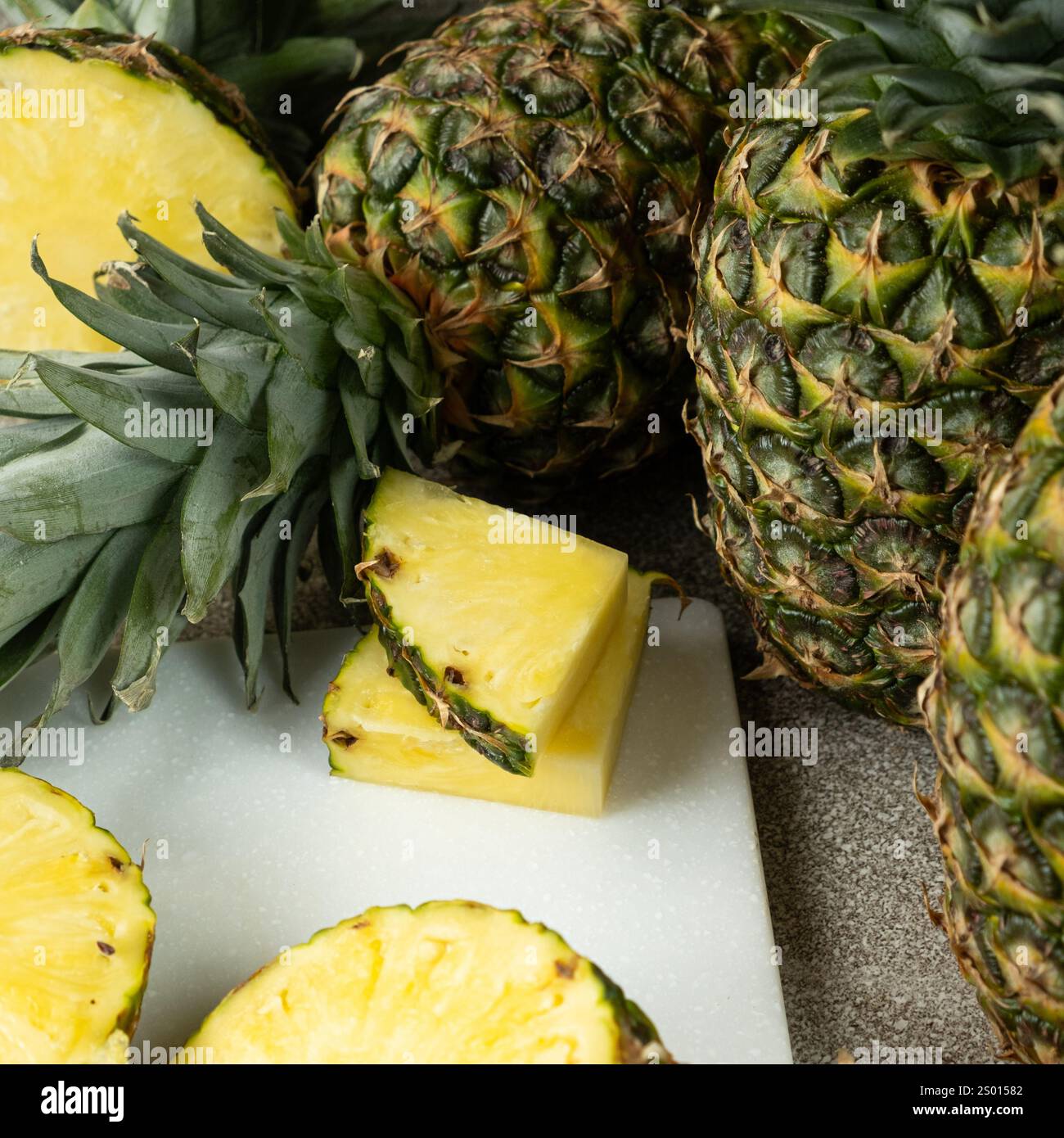 Pineapple background - whole fruit pineapples and cut into pieces and rings Stock Photo - Alamy