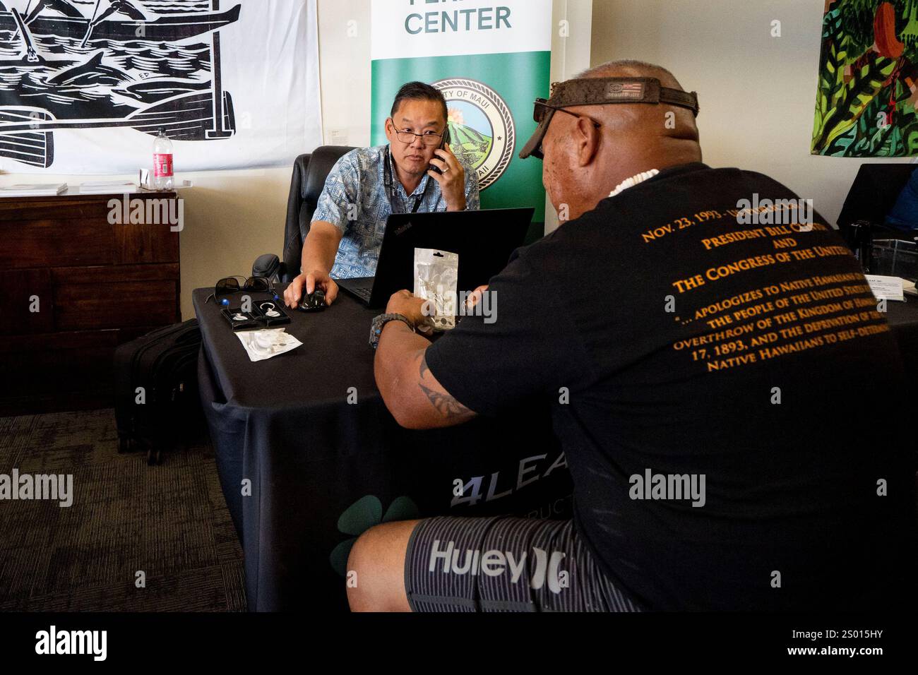 Peter Lim, a supervising building inspector for 4LEAF, helps Edyngton ...