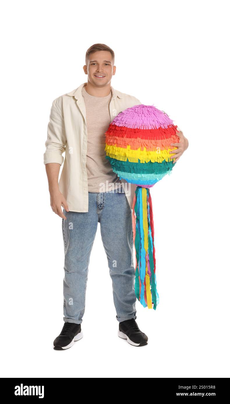 Happy man with colorful pinata on white background Stock Photo - Alamy
