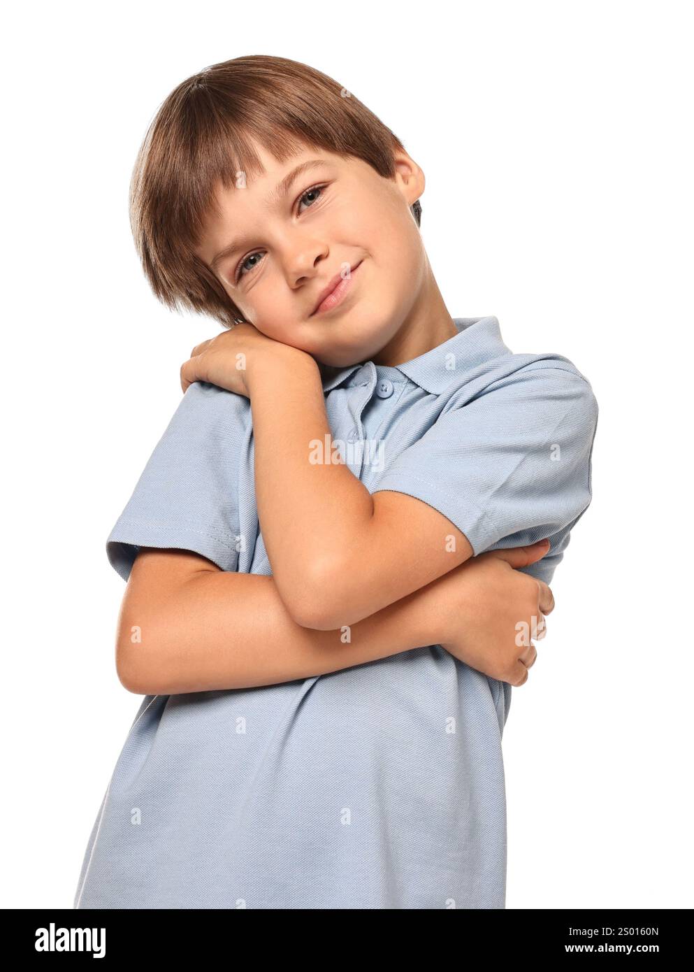 Cute little boy hugging himself on white background Stock Photo - Alamy