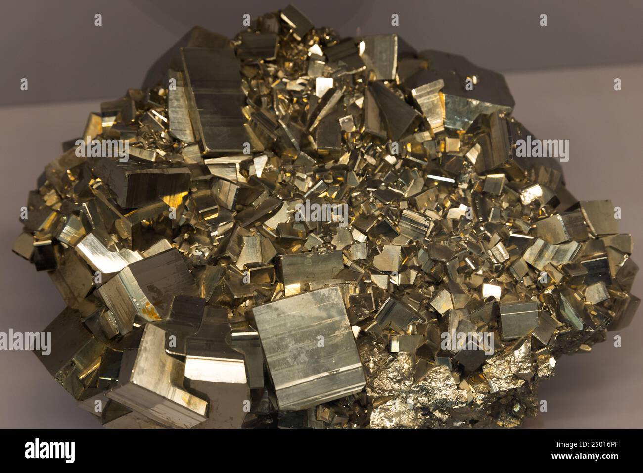 Druse of shiny cubic crystals. The mineral pyrite or iron pyrite, also ...