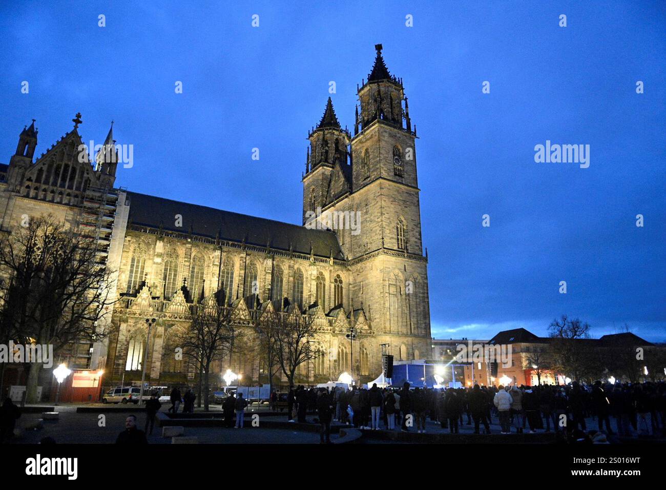 Magdeburg, Germany. 23rd Dec, 2024. Participants at an AfD rally wait ...