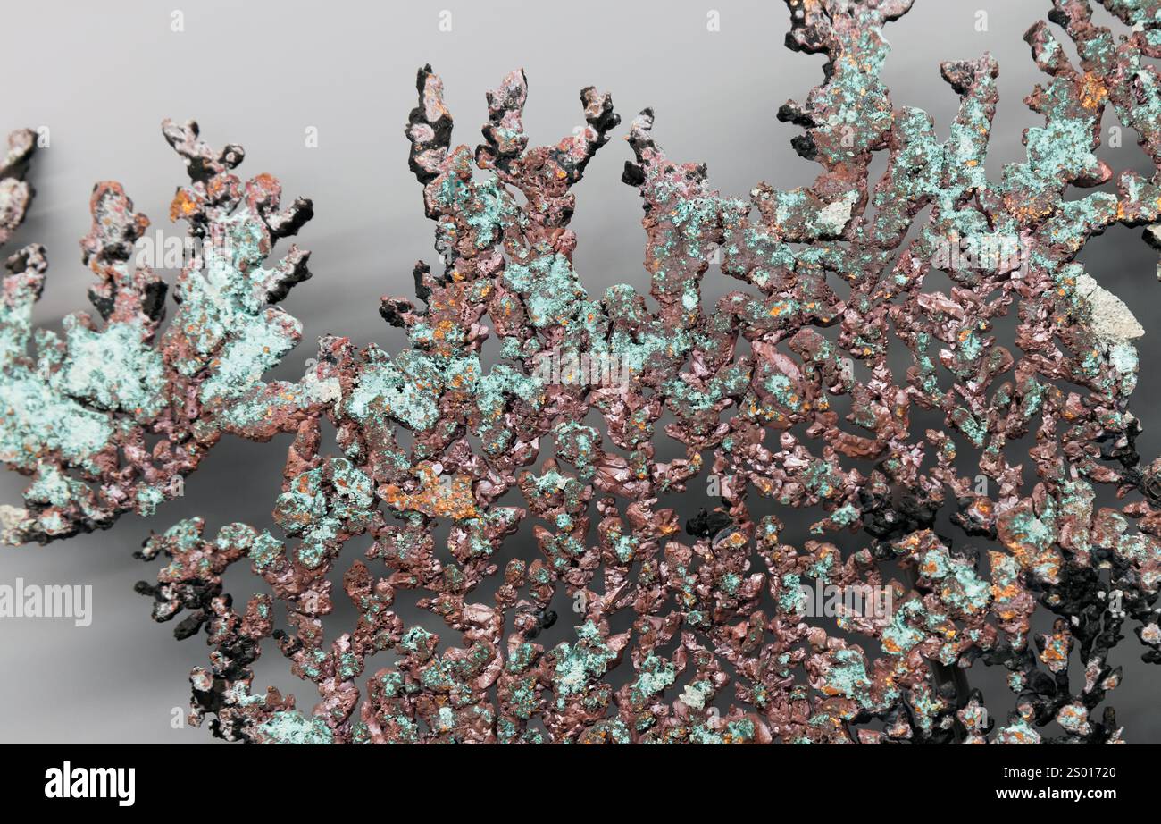 Native copper, macro photo of natural crystal over gray wall background ...