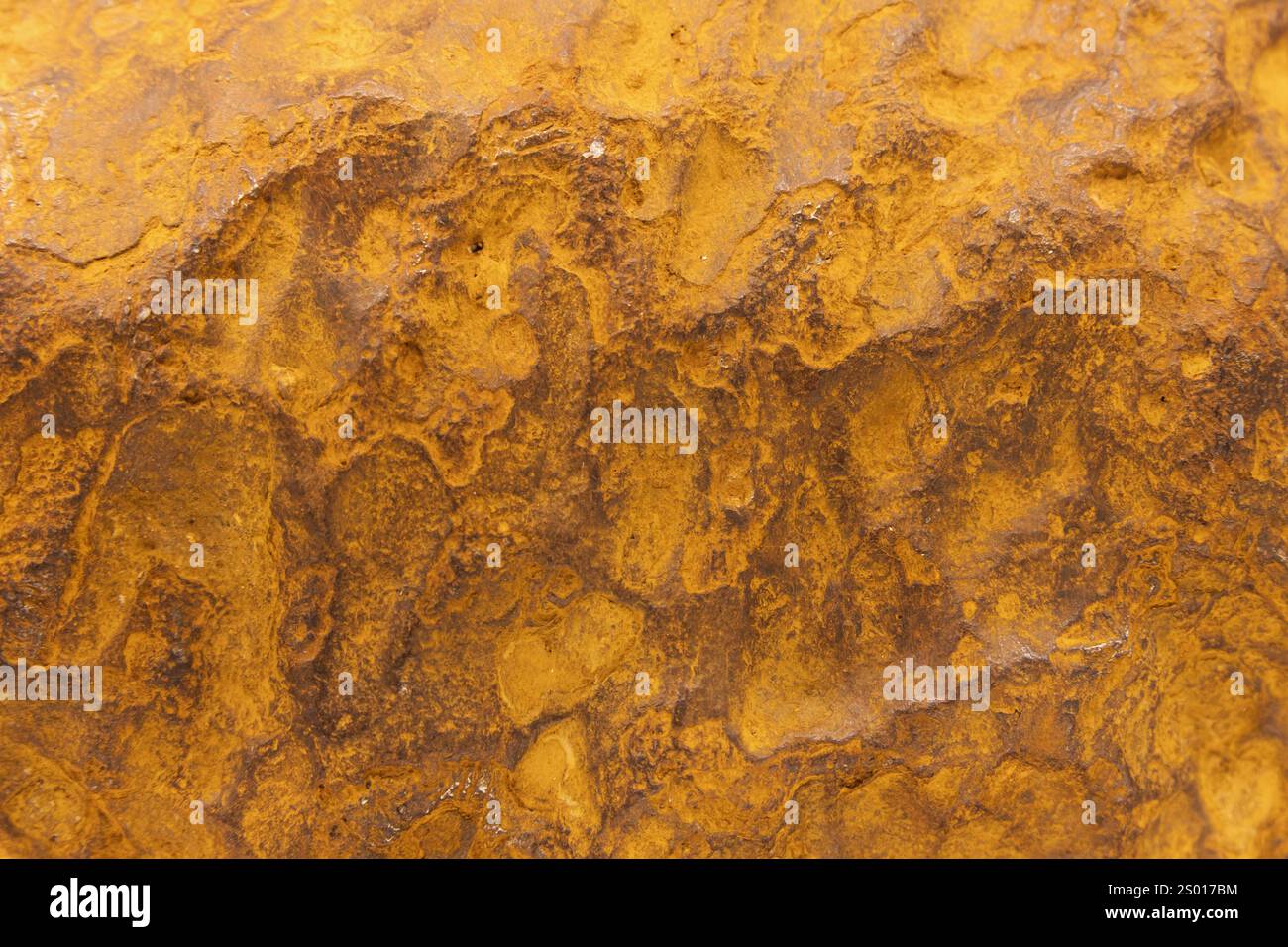 Unpolished rough yellow meteorite surface, abstract natural background ...