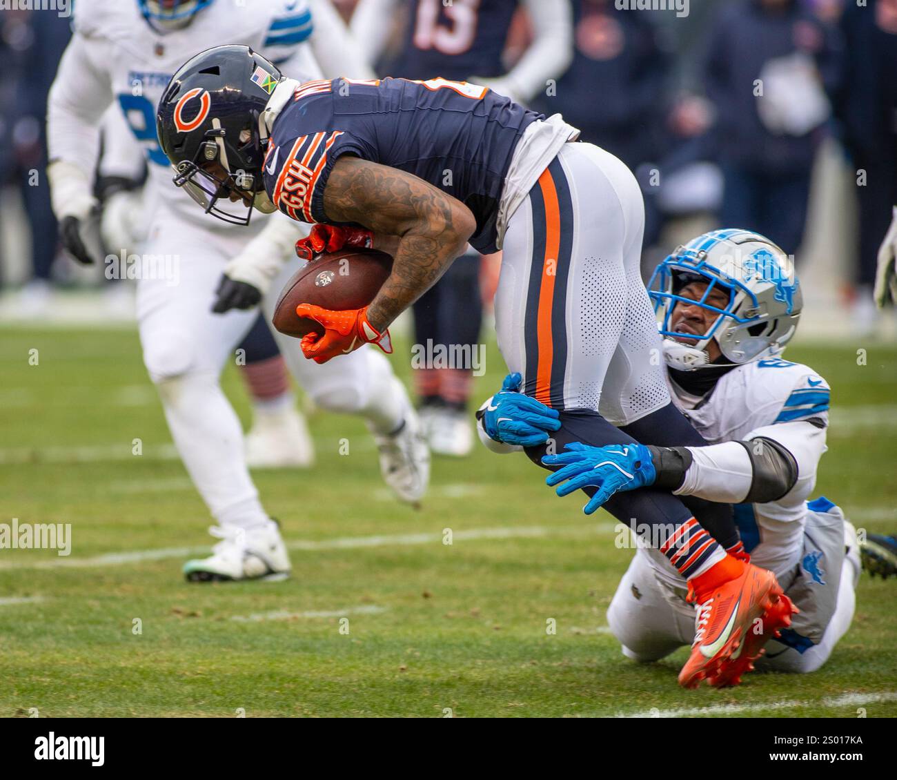 Chicago Bears DJ Moore (2) is tackled by Detroit Lions Al-Quadin ...