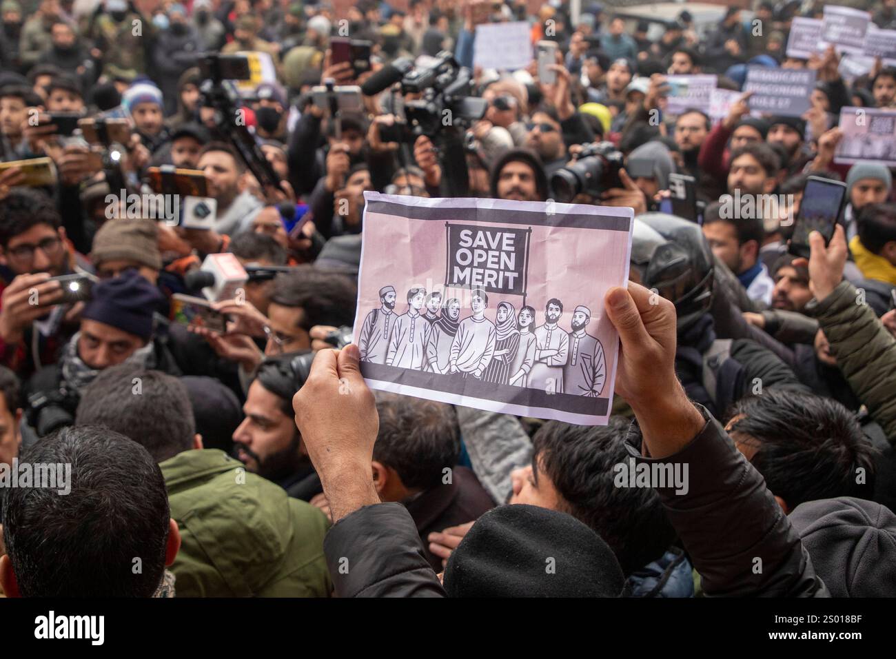 A Kashmiri student holds a placard as he takes part in a protest led by ...