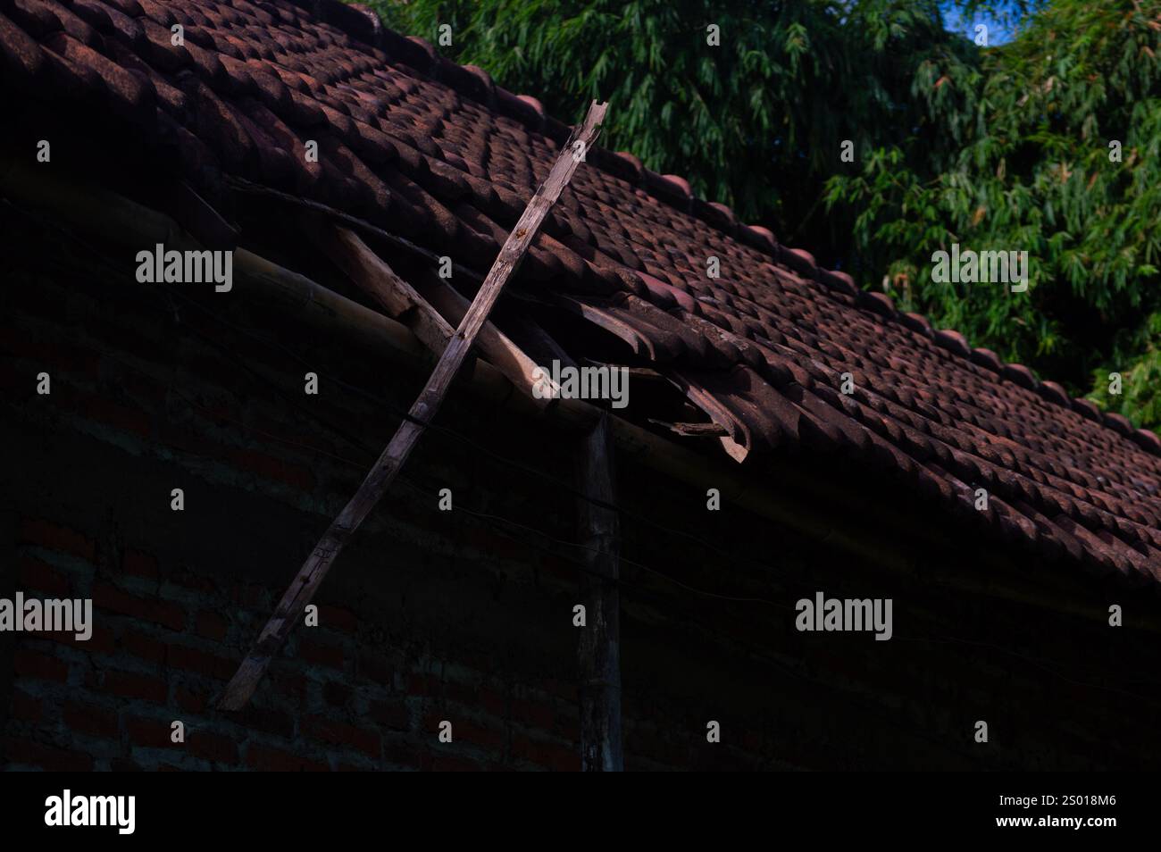 the wood supporting the roof of the house is starting to rot Stock ...