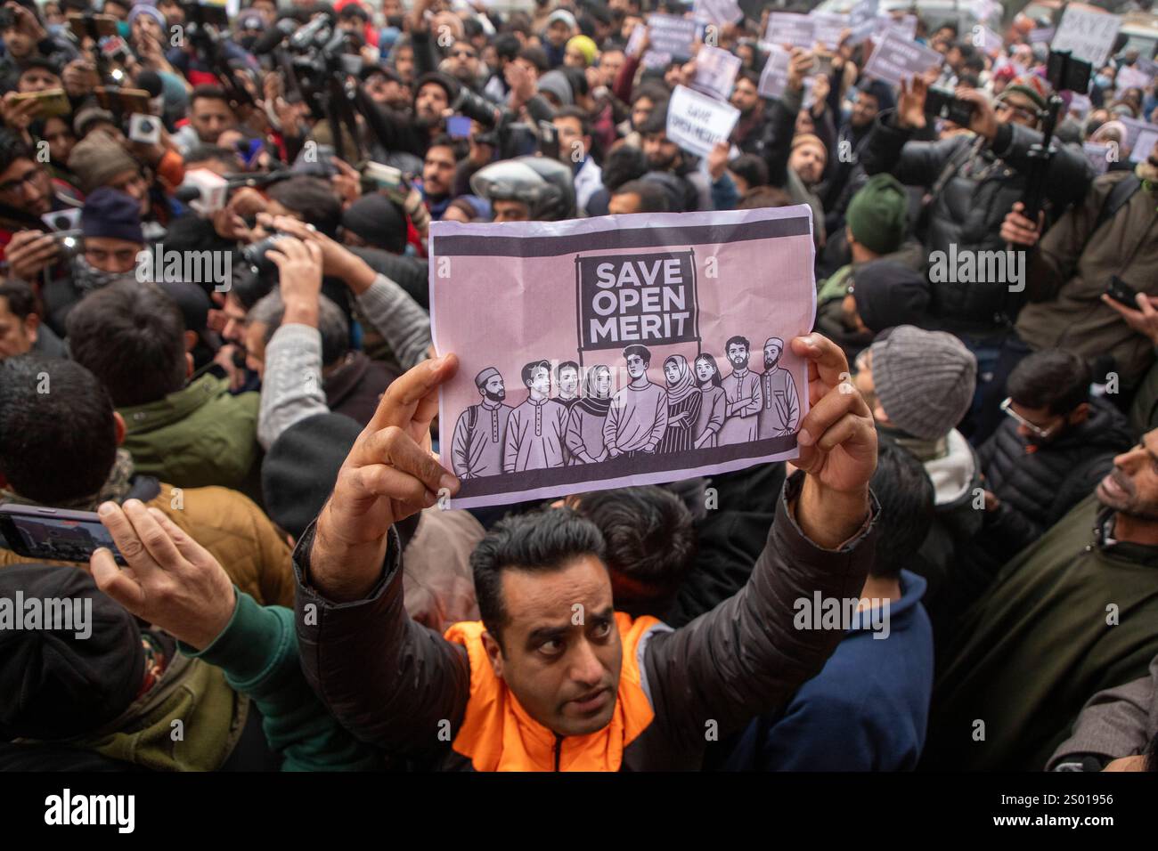 A Kashmiri man holds a placard as he takes part in a protest led by the ...