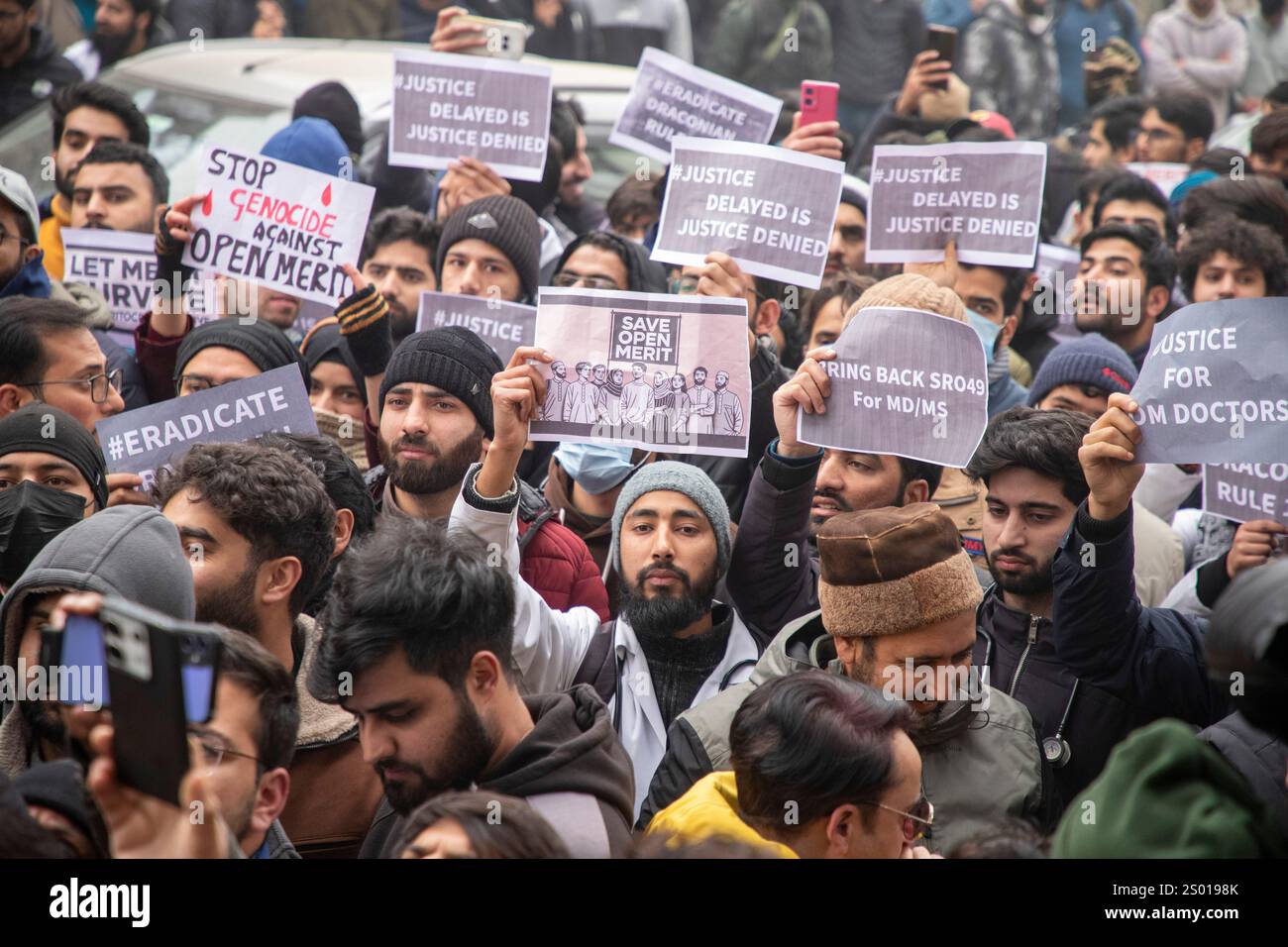 Kashmiri students hold placards as they take part in a protest led by ...