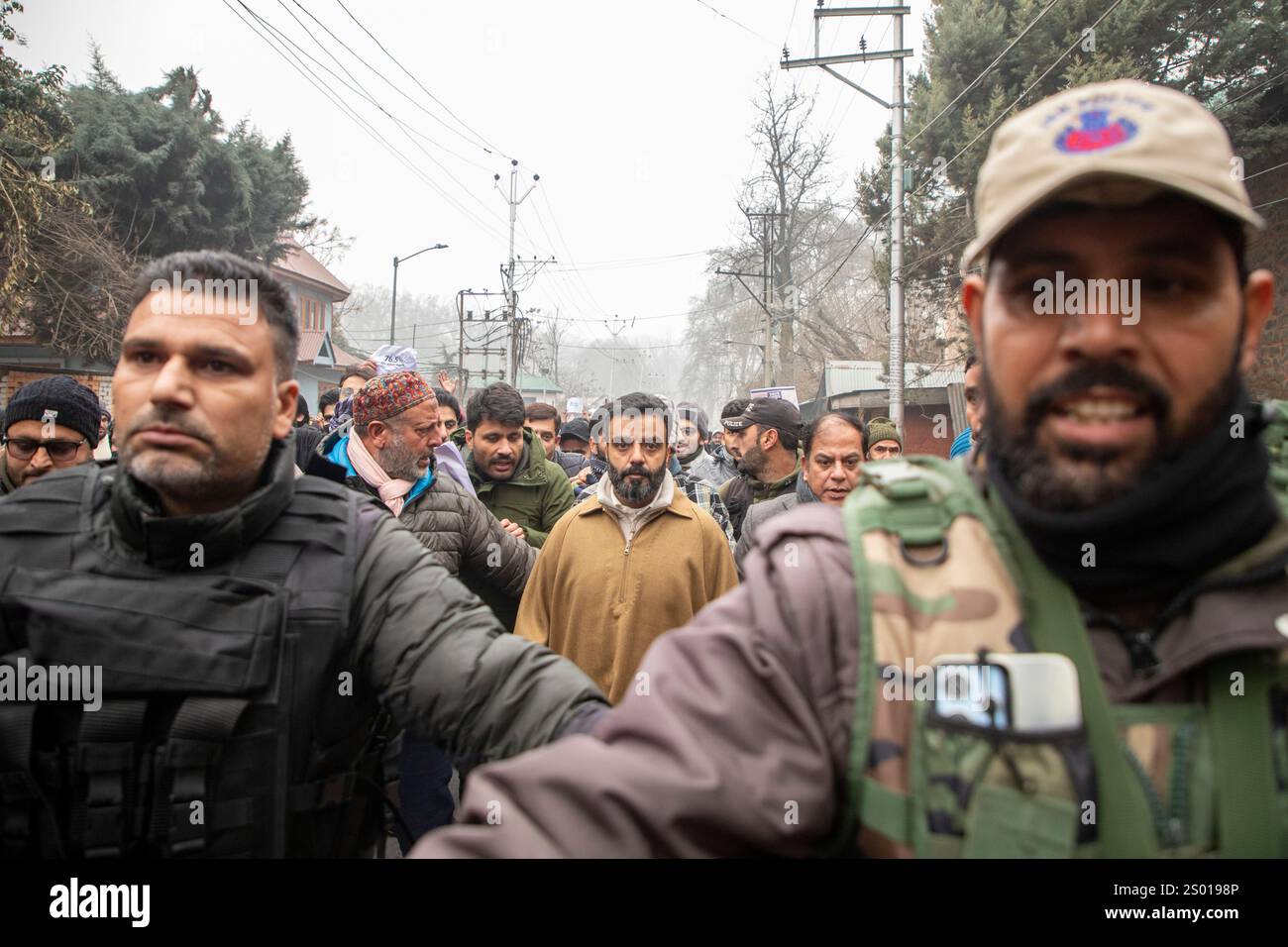 Indian policemen guard the ruling National Conference leader and member ...