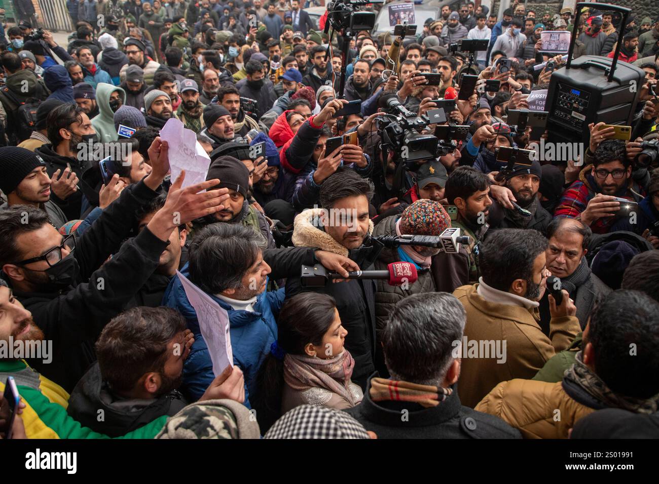 Jammu and Kashmir legislative Assembly member Waheed Para (C) and the ...