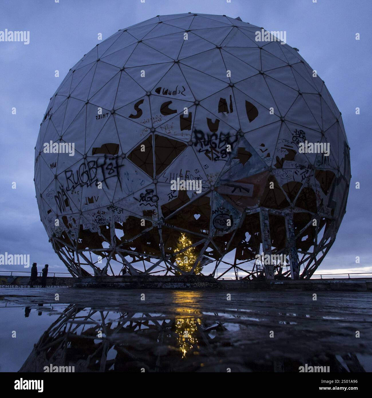 A Christmas tree stands inside a radar dome at the former listening ...