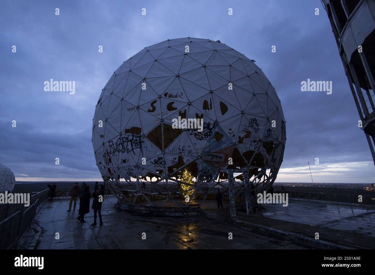 A Christmas tree stands inside a radar dome at the former listening ...