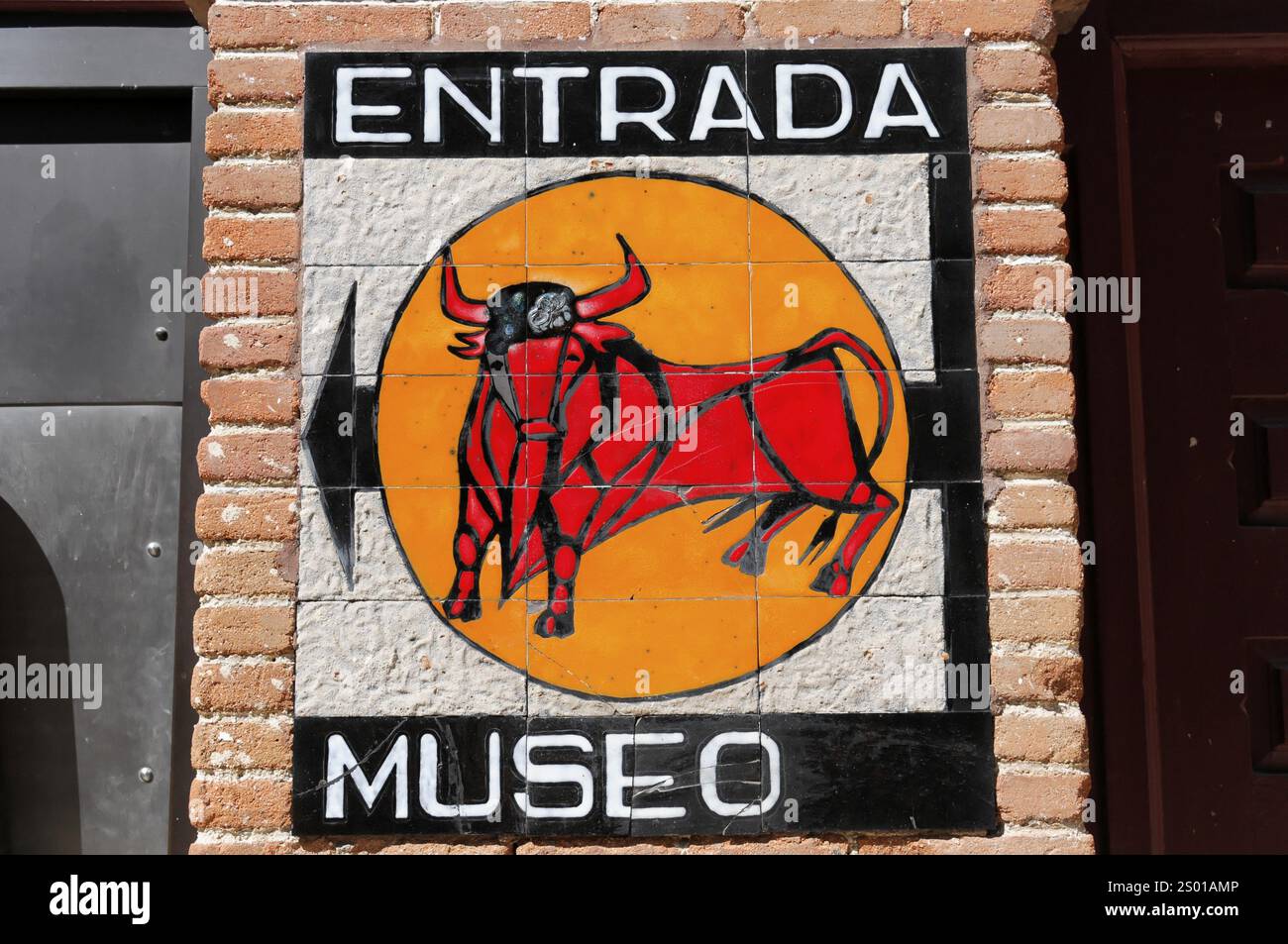 Madrid, Spain, Europe, Entrance sign of a museum shows a red bull on an ...