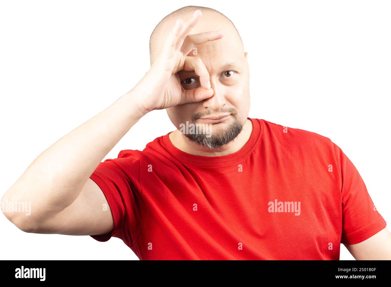 A man wearing a red T-shirt is posing with a playful hand gesture ...
