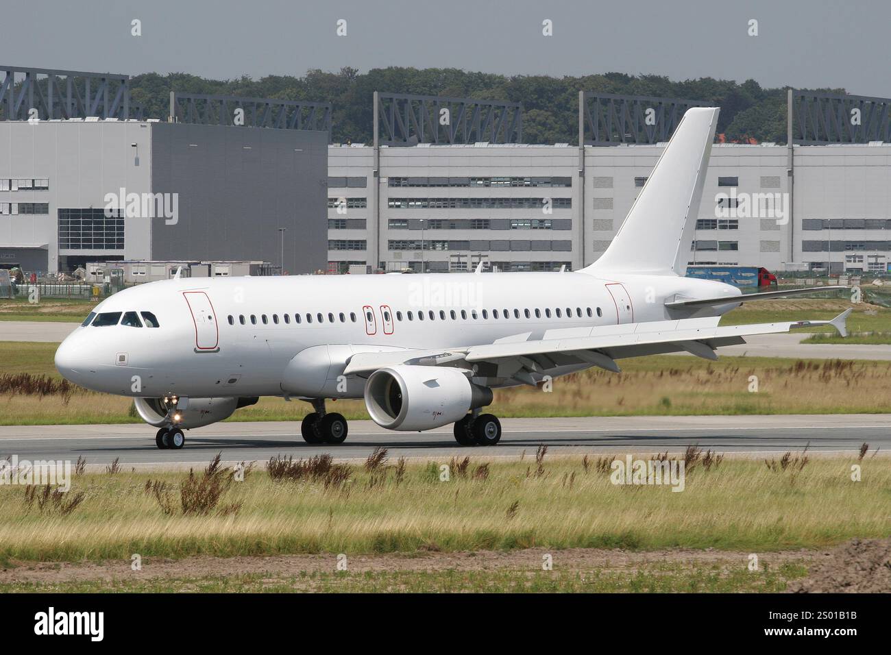 Modern White Passenger Plane performing a rejected takeoff test at ...