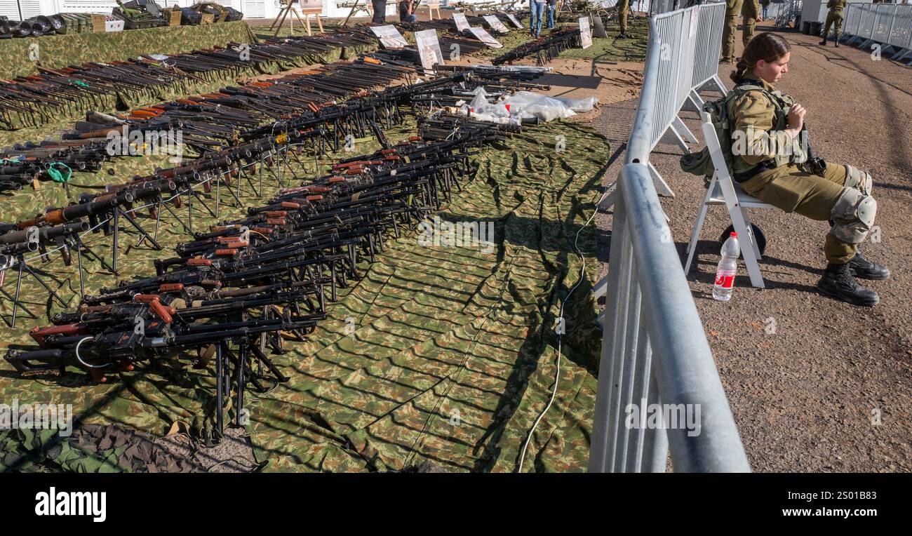 Amirim, Israel. 23rd Dec, 2024. An Israeli soldier sits guard outside a ...