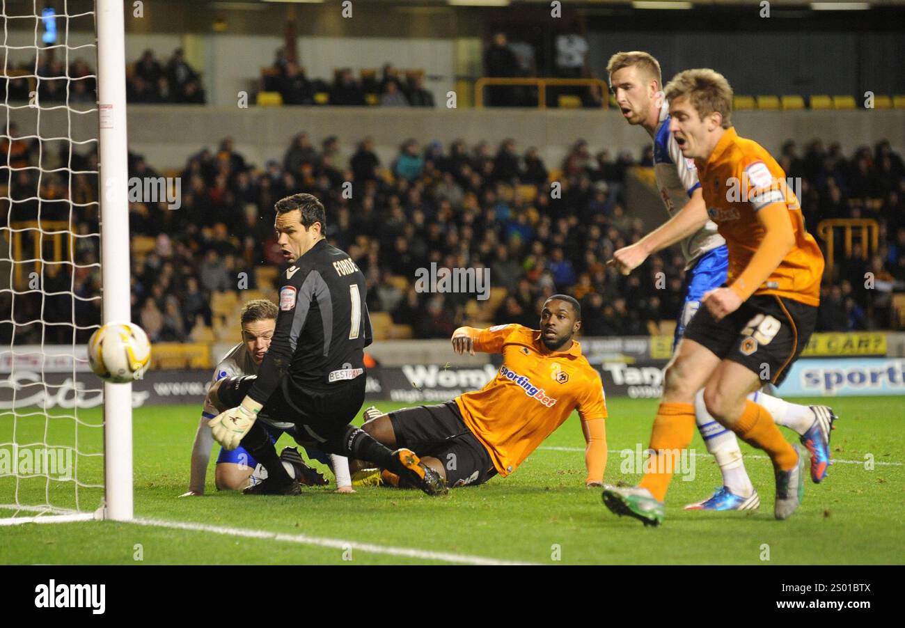 Millwall goalkeeper David Forde looks back as Sylvan Ebanks-Blake of ...