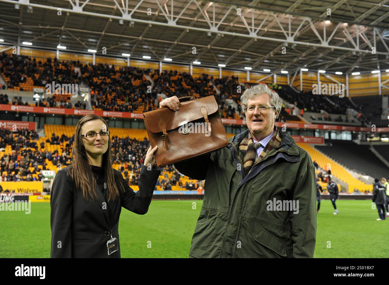 Sophie Cawthorne accepts Stan Cullis's briefcase from Rev Andrew Cullis ...