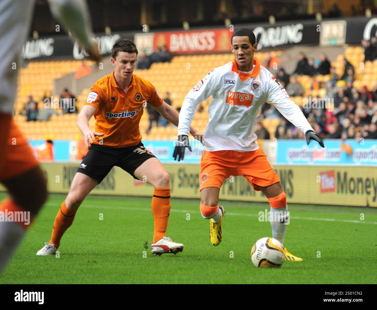 Thomas Ince of Blackpool and Kevin Foley of Wolverhampton Wanderers ...