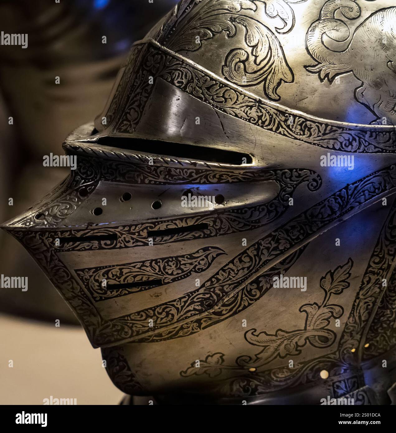 Close-up of an ornate medieval knight's helmet with intricate ...