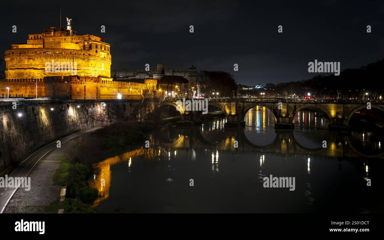 A night view of Castel Sant'Angelo in Rome, illuminated against the ...